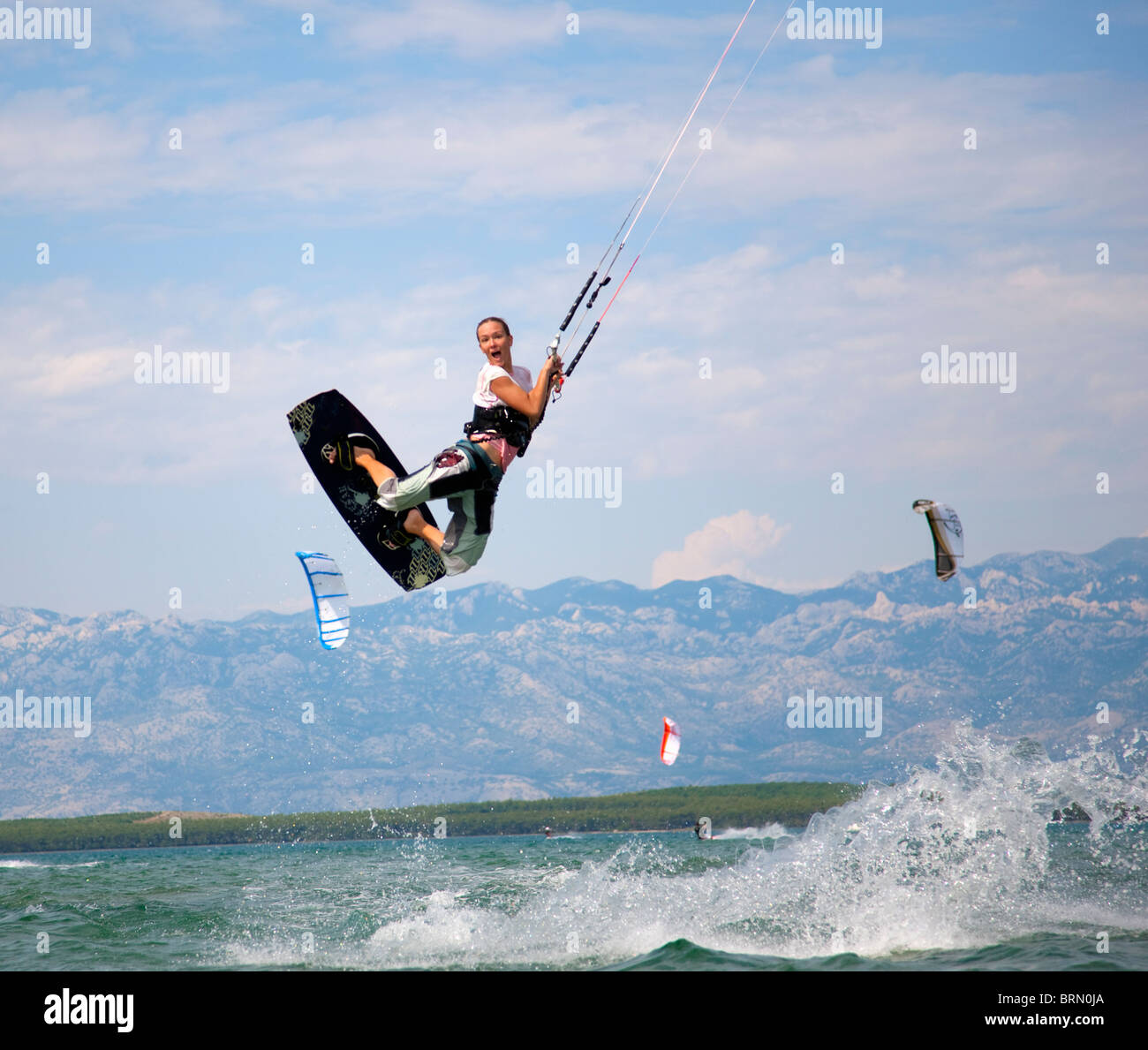 Leaping kitesurfer hi-res stock photography and images - Alamy