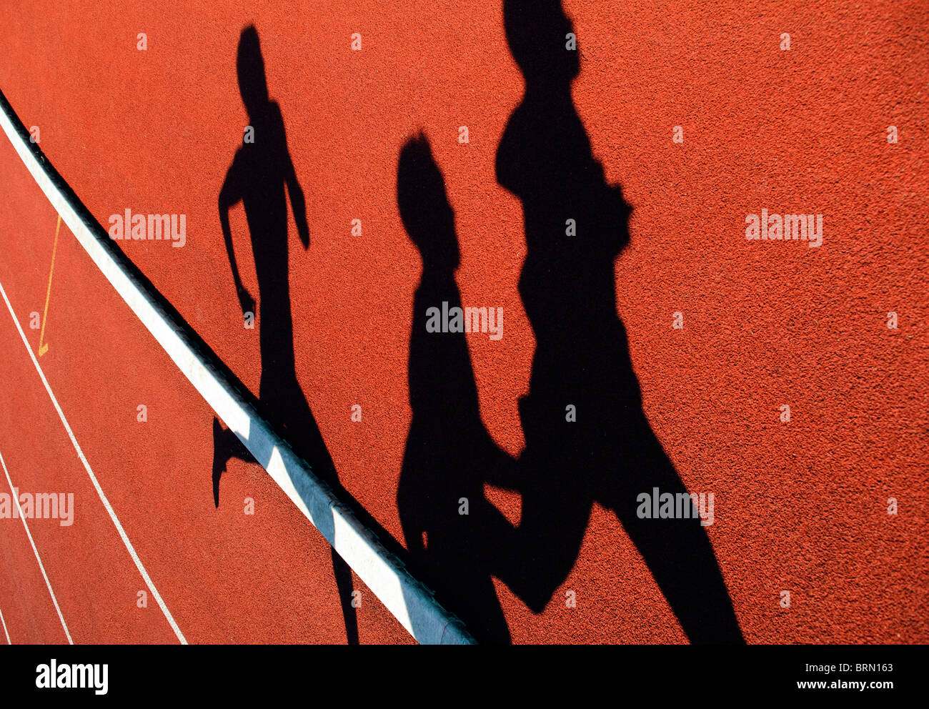 shadows of runners during 800m race during outdoor track and field ...