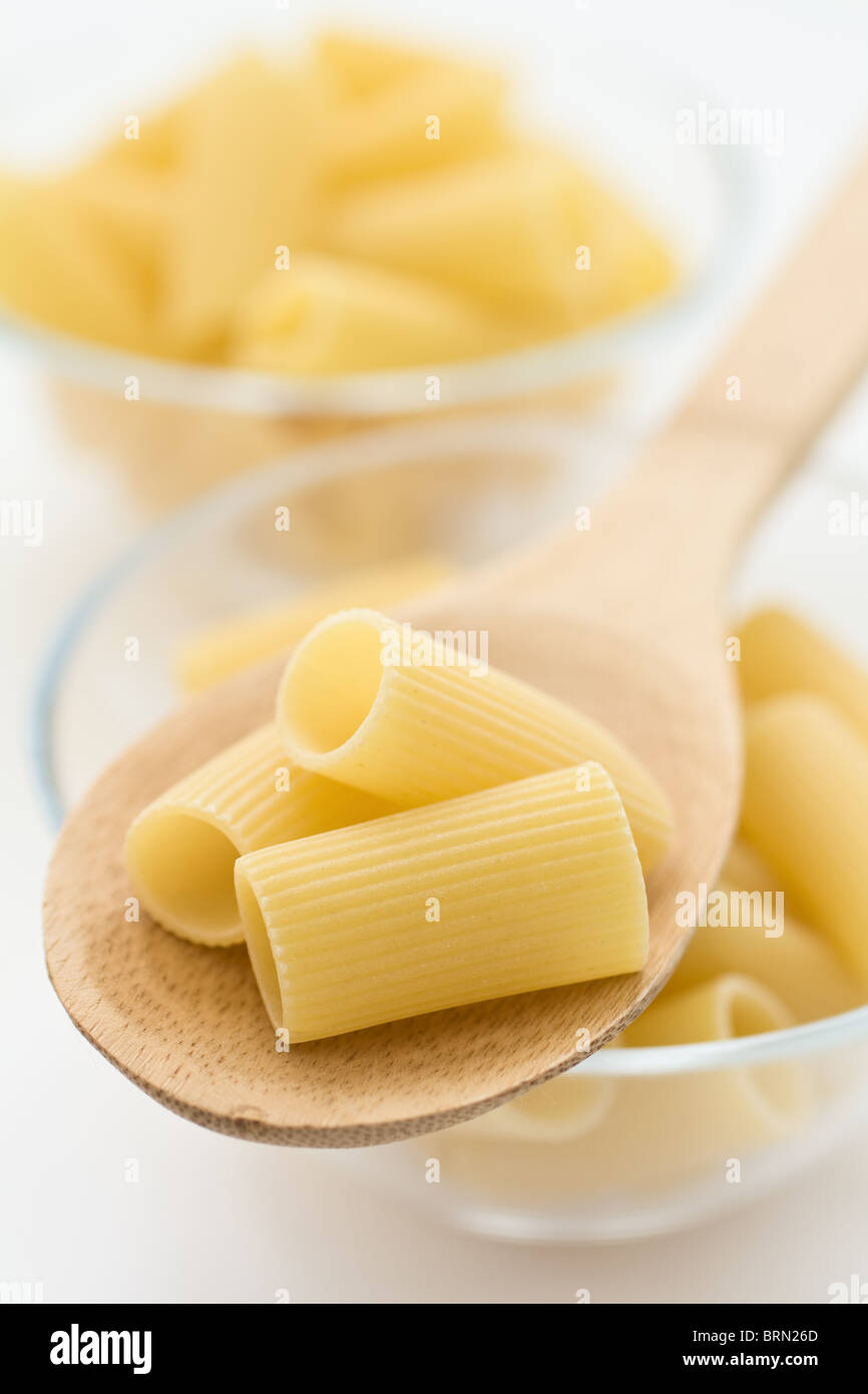 Closeup of raw italian pasta on white background Stock Photo - Alamy