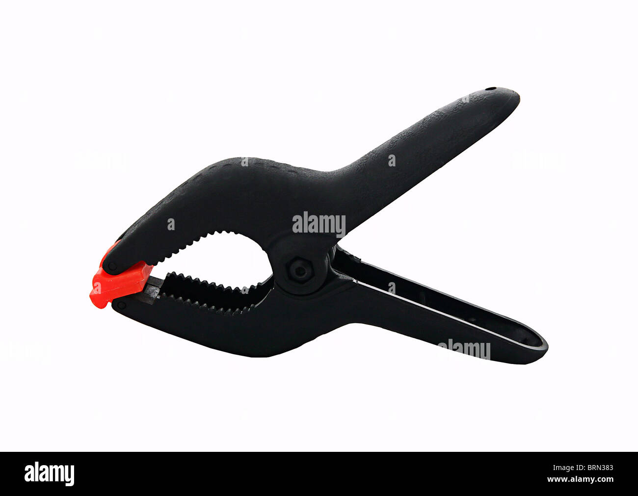 a large black plastic clamp isolated on white Stock Photo - Alamy