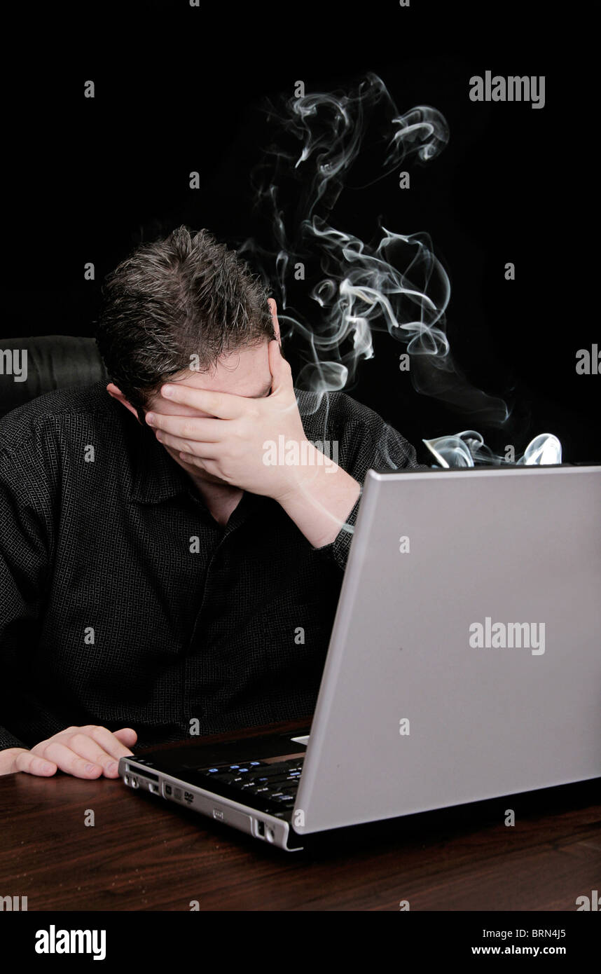 smoking computer leaves businessman frustrated and angry Stock Photo ...