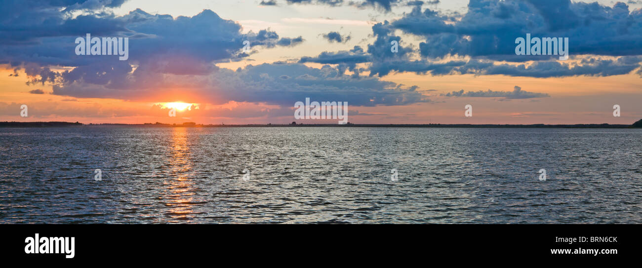 Lake sunset view with sunlight path. Two shots stitch image Stock Photo ...