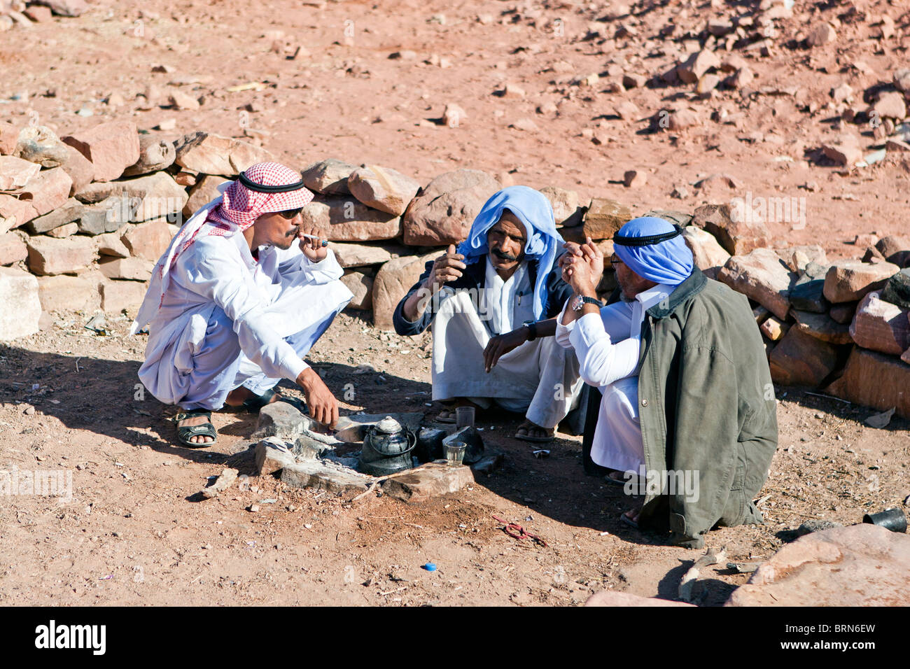 Bedouins sat around a camp fire at the White Canyon, Sinai, Egypt Stock ...