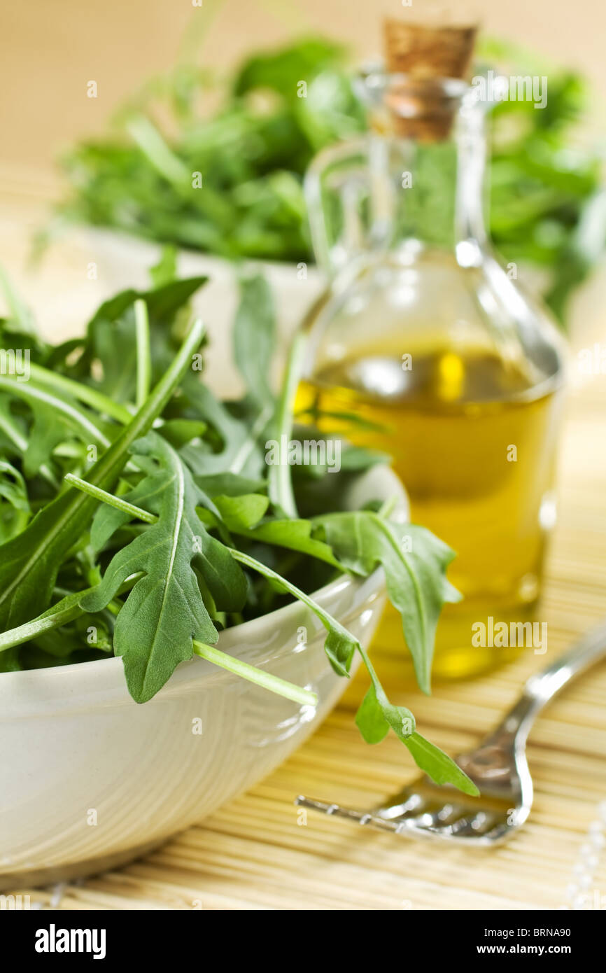 Closeup Of Fresh Rucola Salad And Oil Stock Photo - Alamy