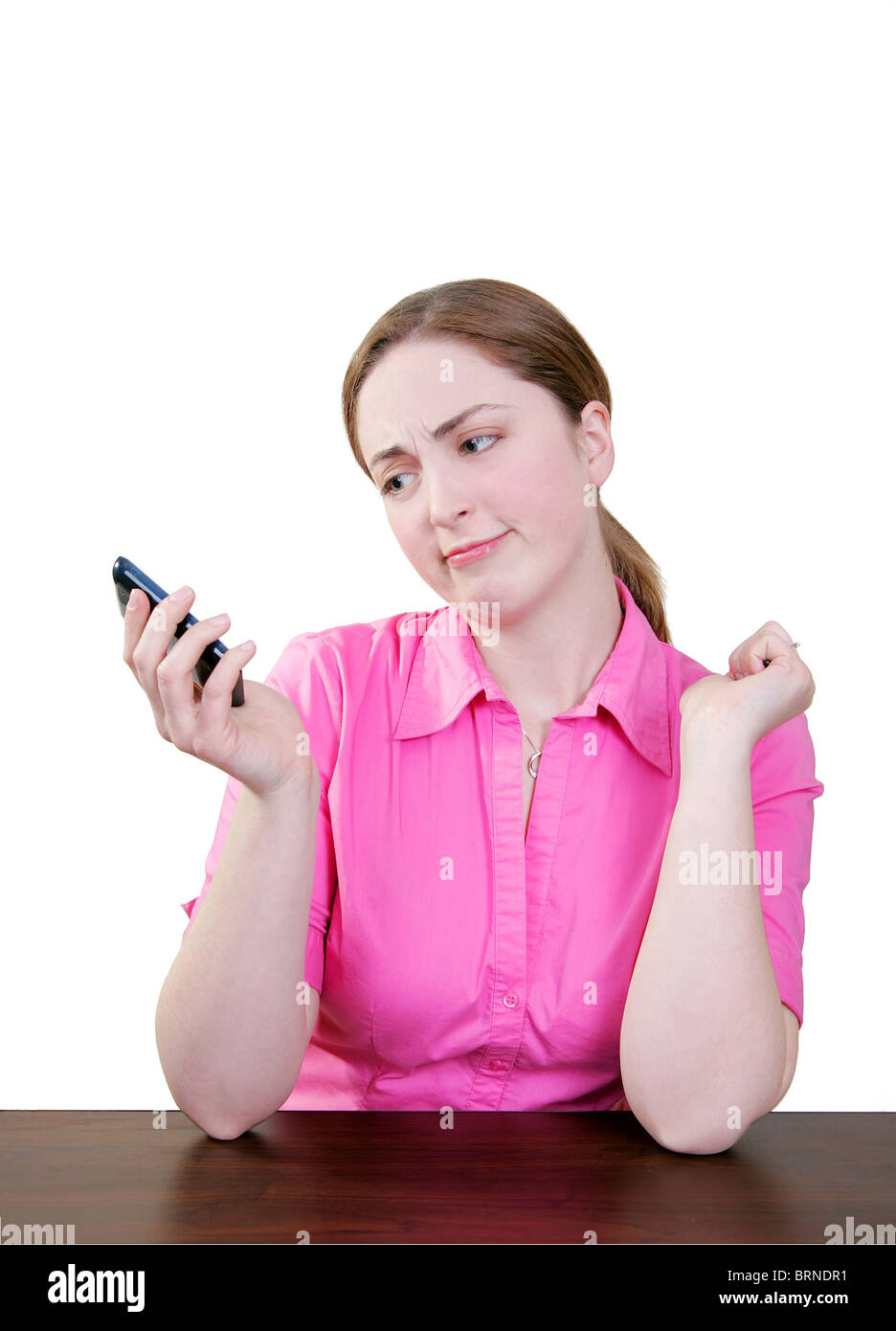businesswoman looking at her pda screen and looking unhappy or upset ...