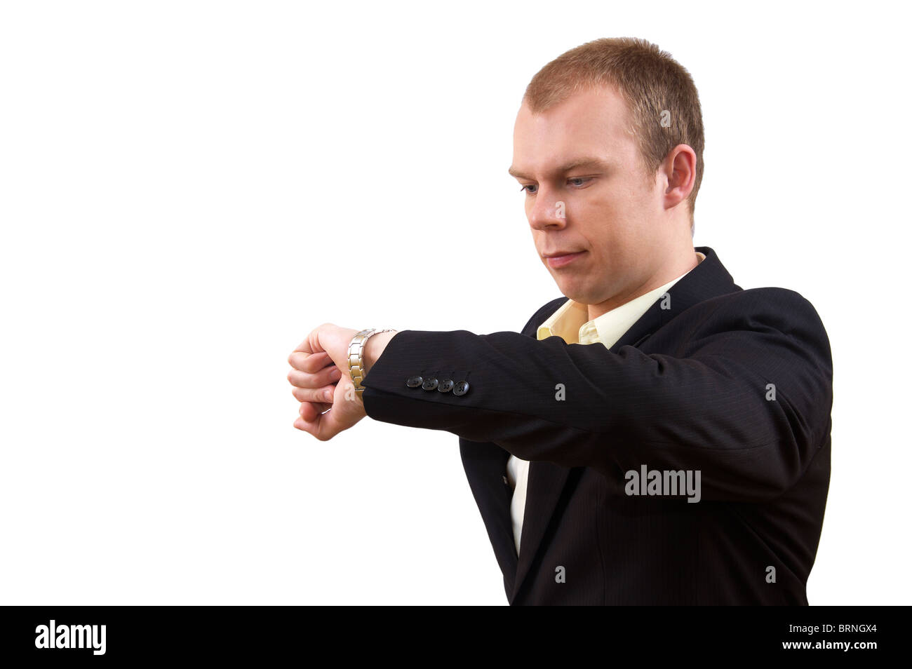 Businessman looking at watch, on white background Stock Photo - Alamy
