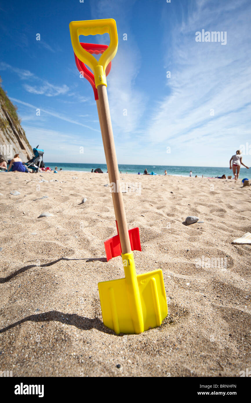 two spades left on the beach Stock Photo - Alamy