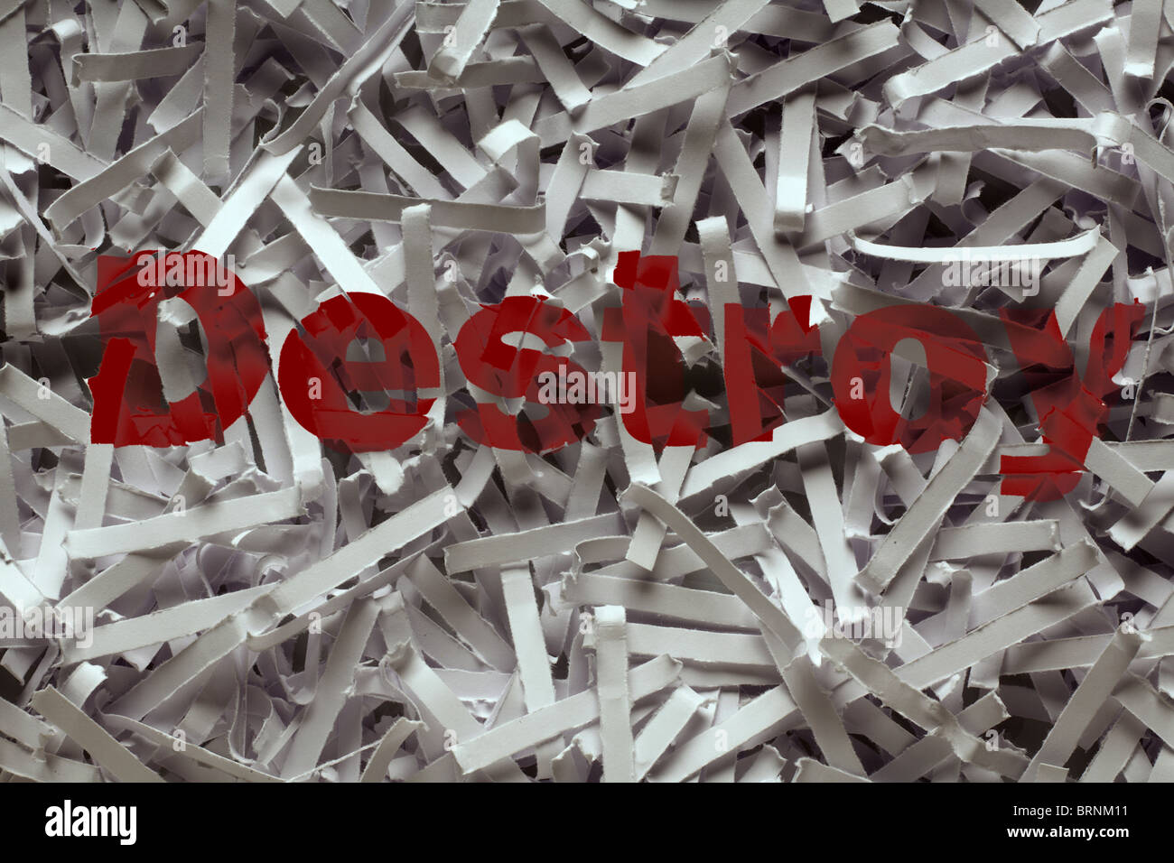 close up detail image of shredded paper with the words destroy printed ...