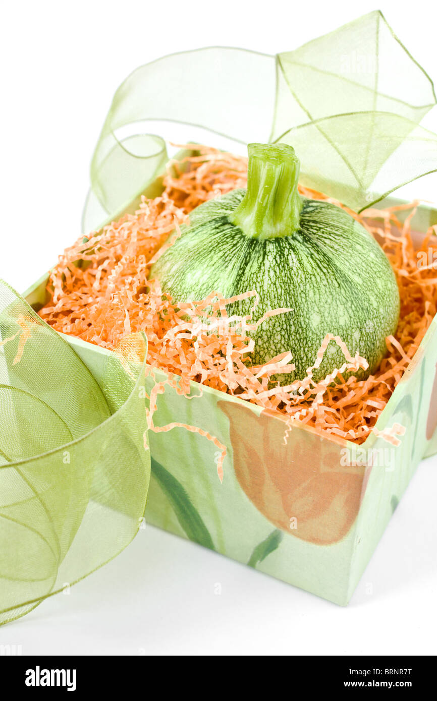 Green zucchini in a gift box isolated on white Stock Photo - Alamy