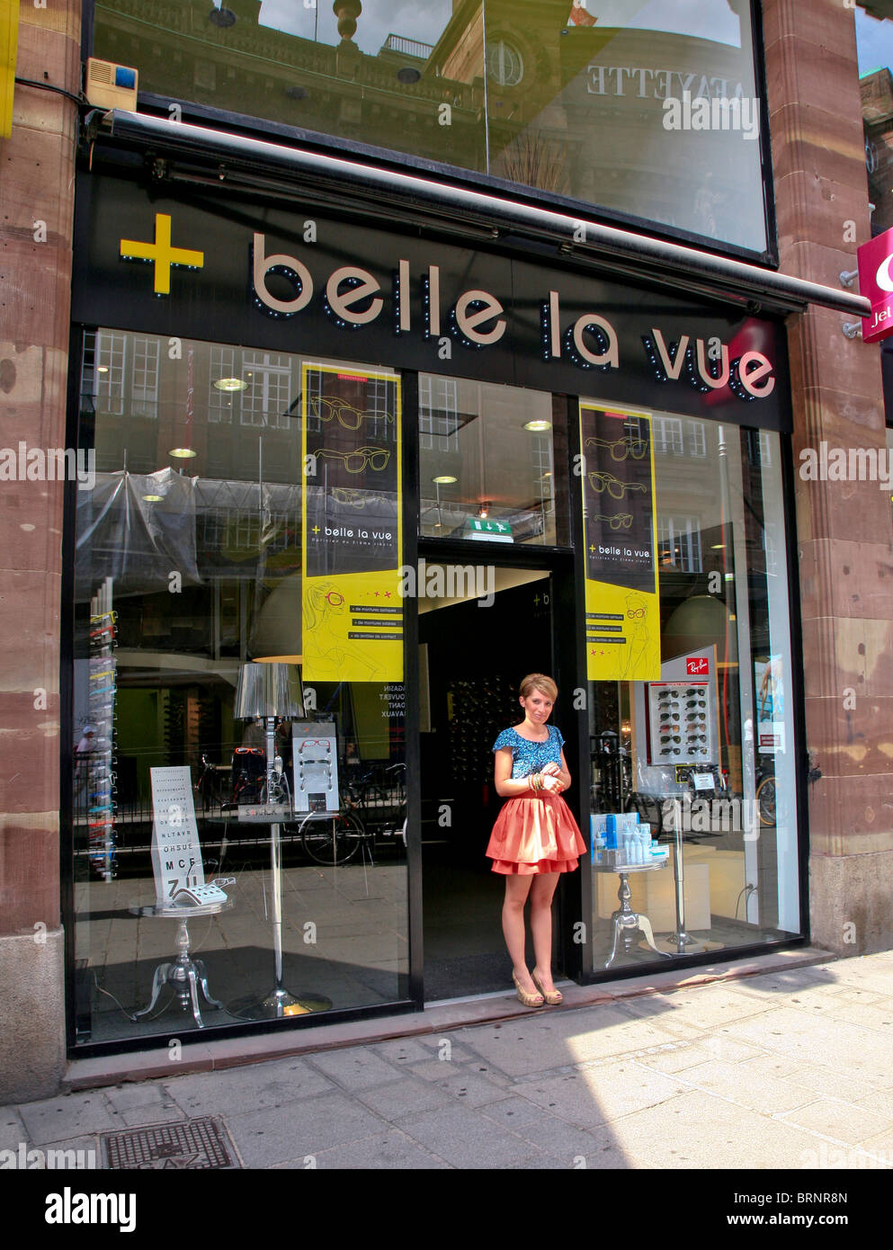 Attractive young French Lady in front of her French Perfume Store in ...