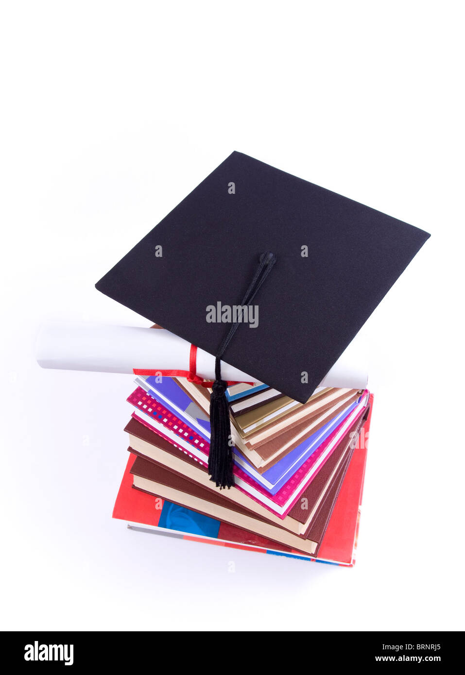 A lot of books, tower made of books with student hat and diploma ...