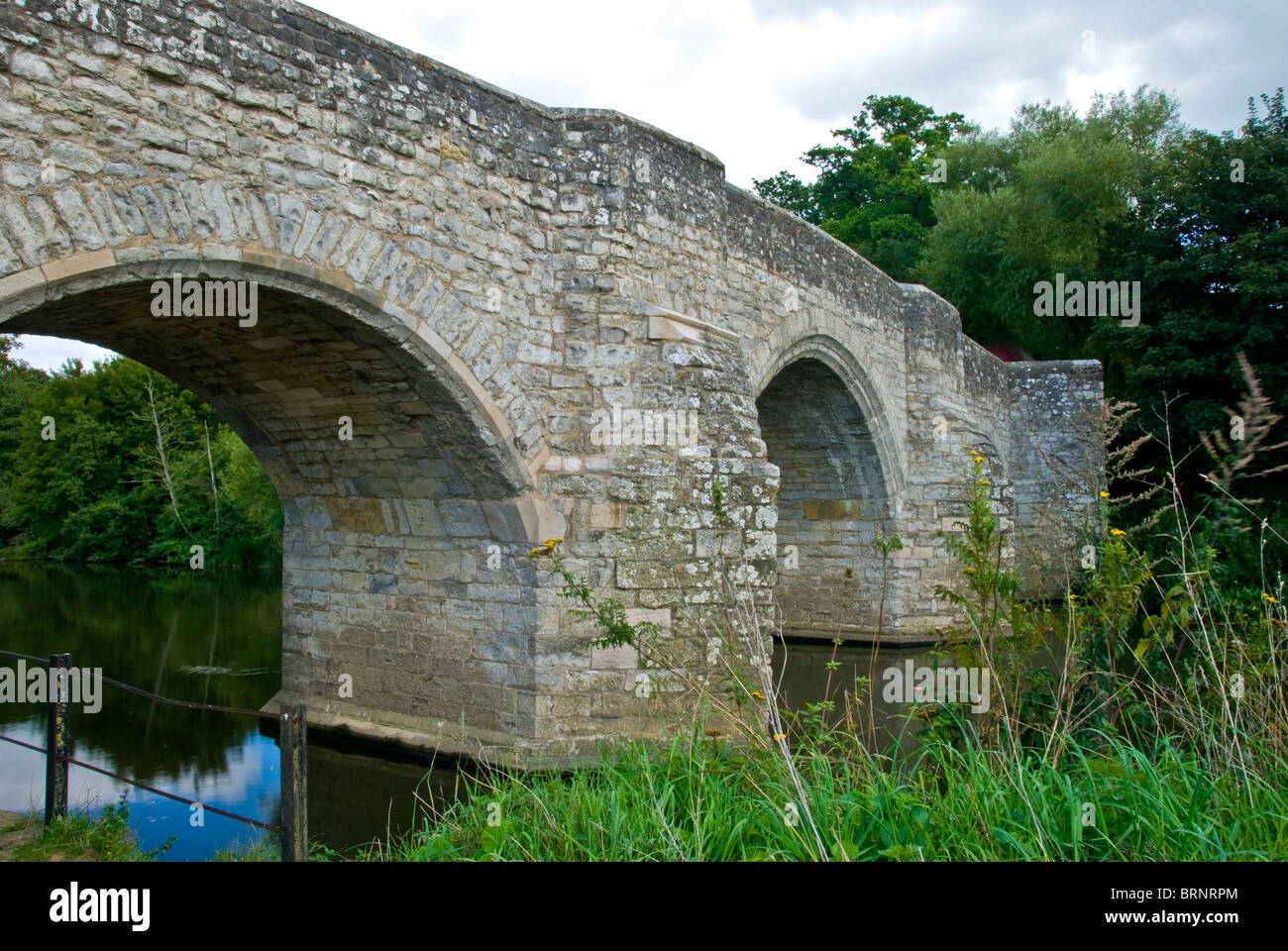 Old stone bridge over a river Stock Photo - Alamy