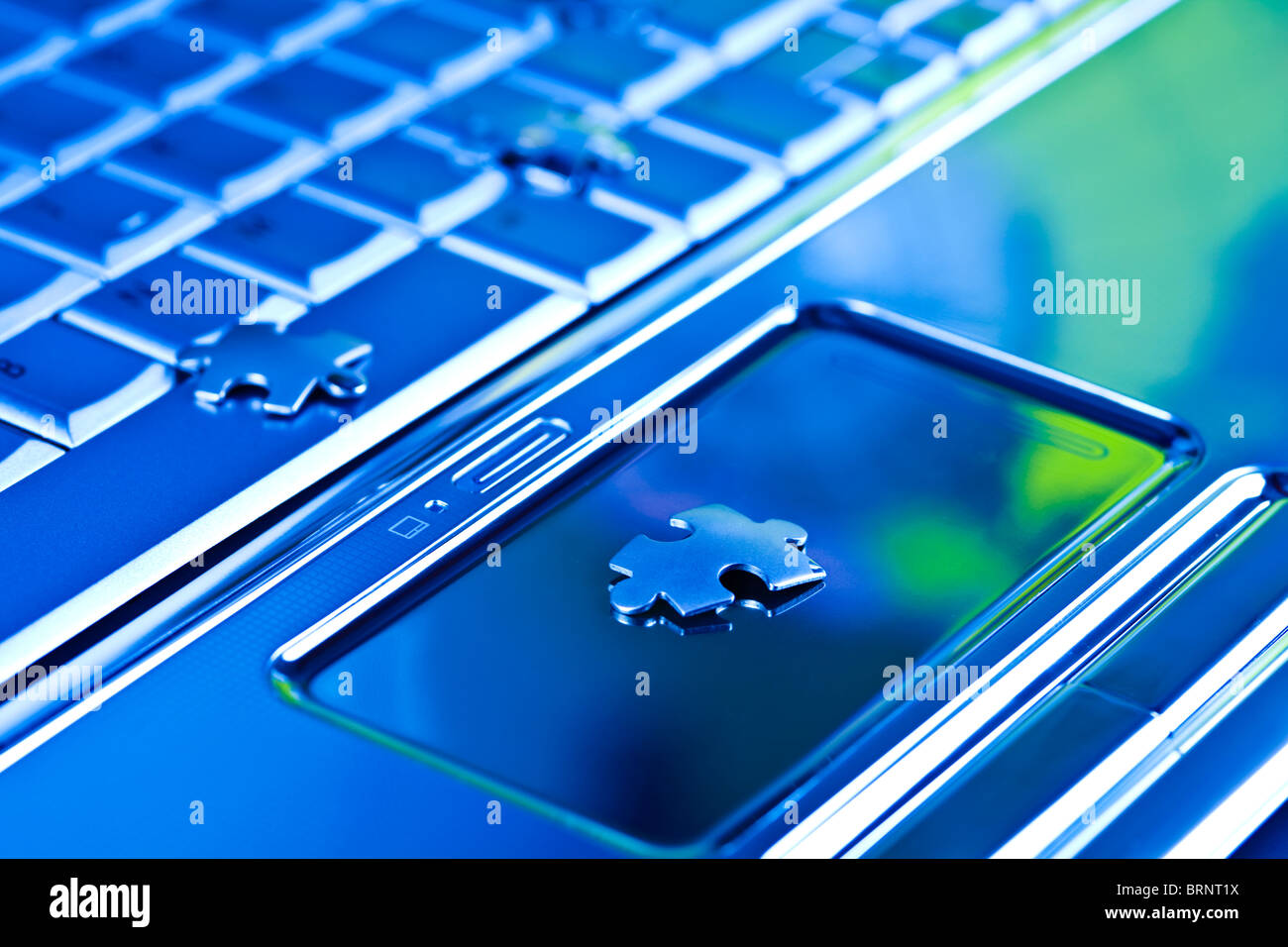 Laptop and puzzle Stock Photo - Alamy