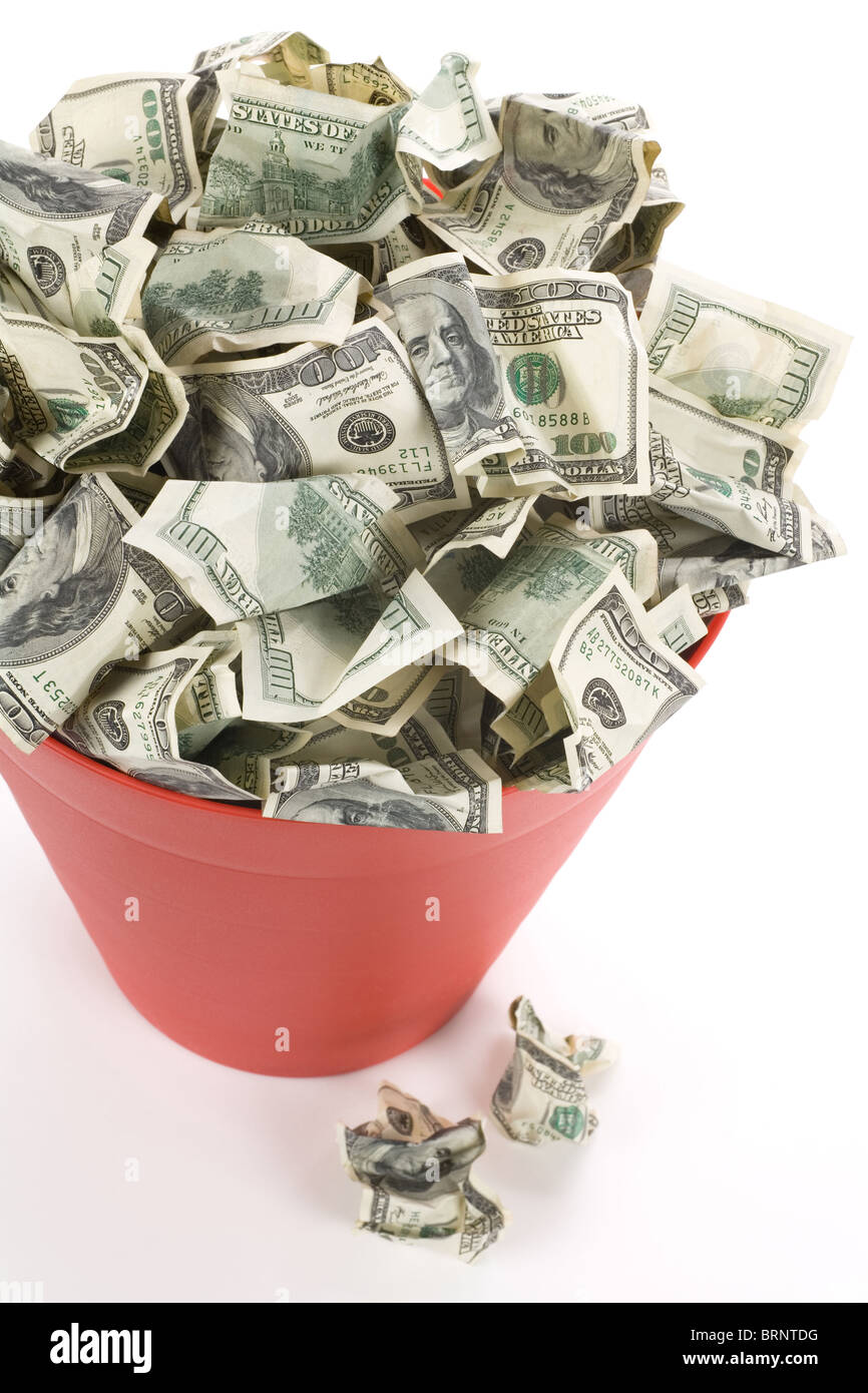 Dollars in Red Garbage Can with White Background Stock Photo - Alamy