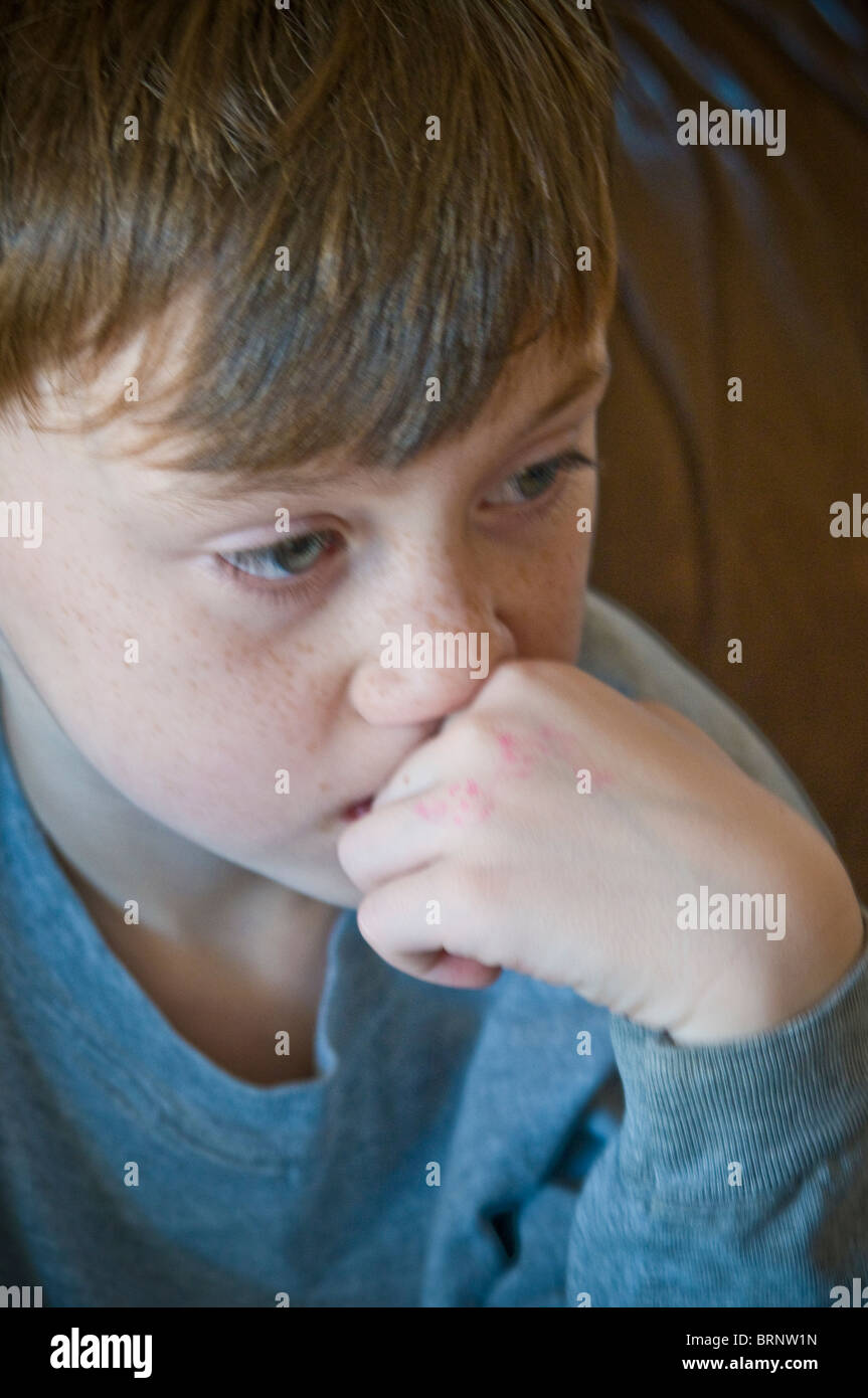 Young boy staring into space Stock Photo - Alamy