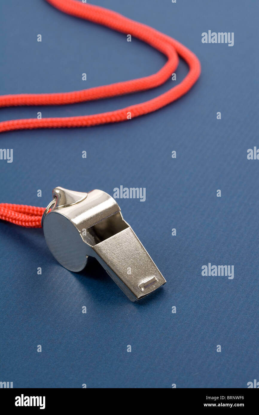 a whistle with blue background Stock Photo - Alamy