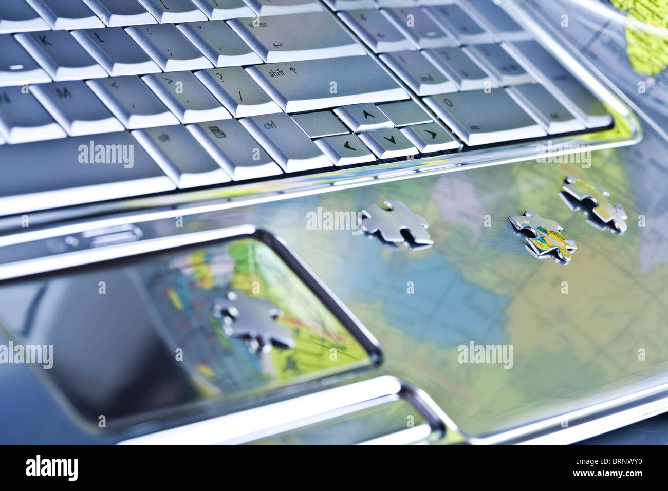 Laptop and puzzle Stock Photo - Alamy