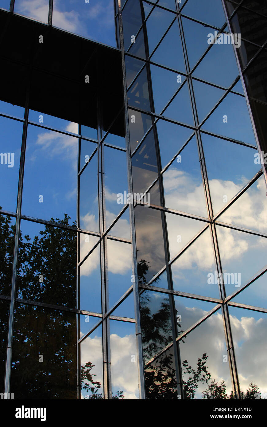 reflections of sky in office window Stock Photo - Alamy