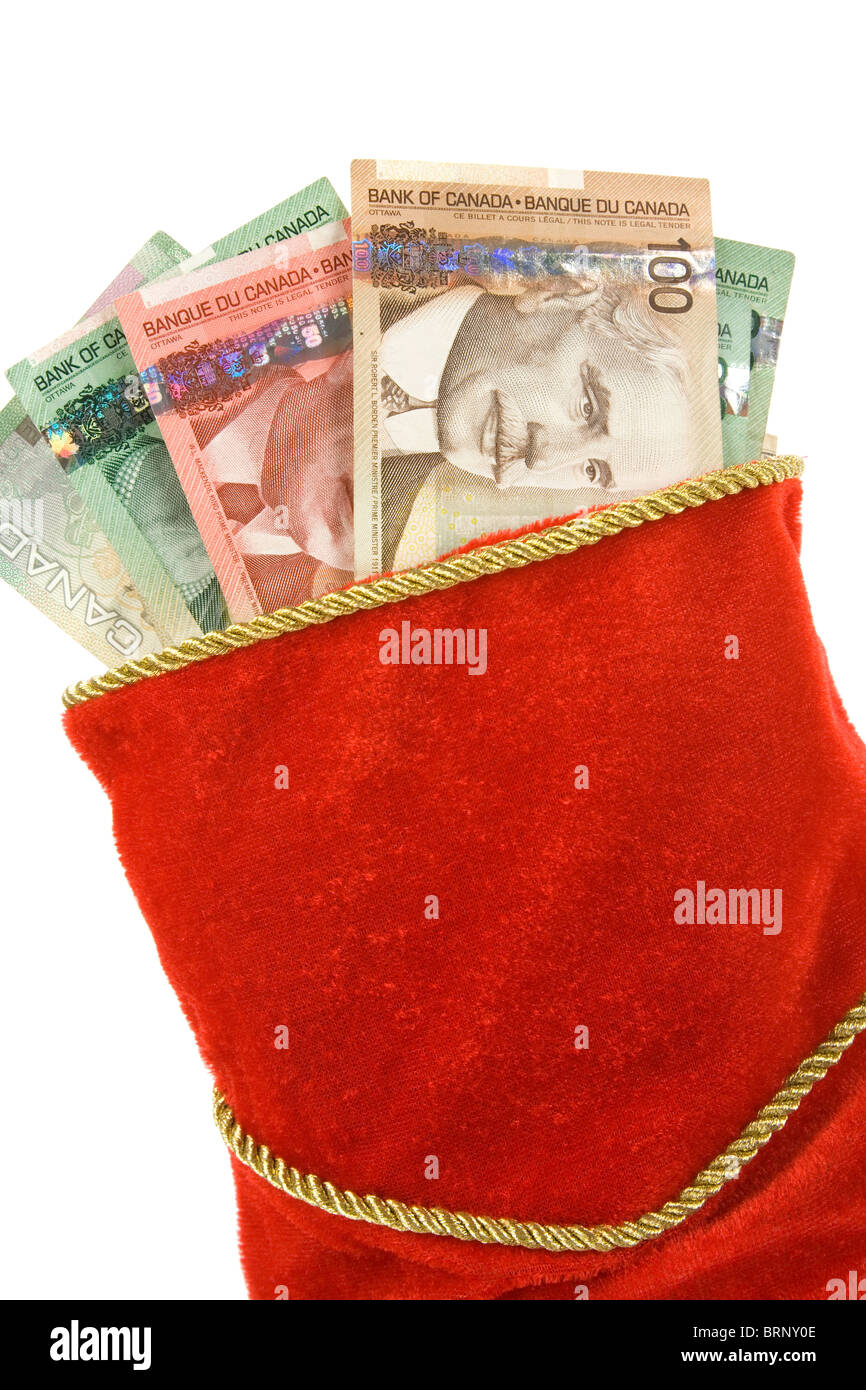 Christmas Stocking and canadian dollars, close up Stock Photo - Alamy