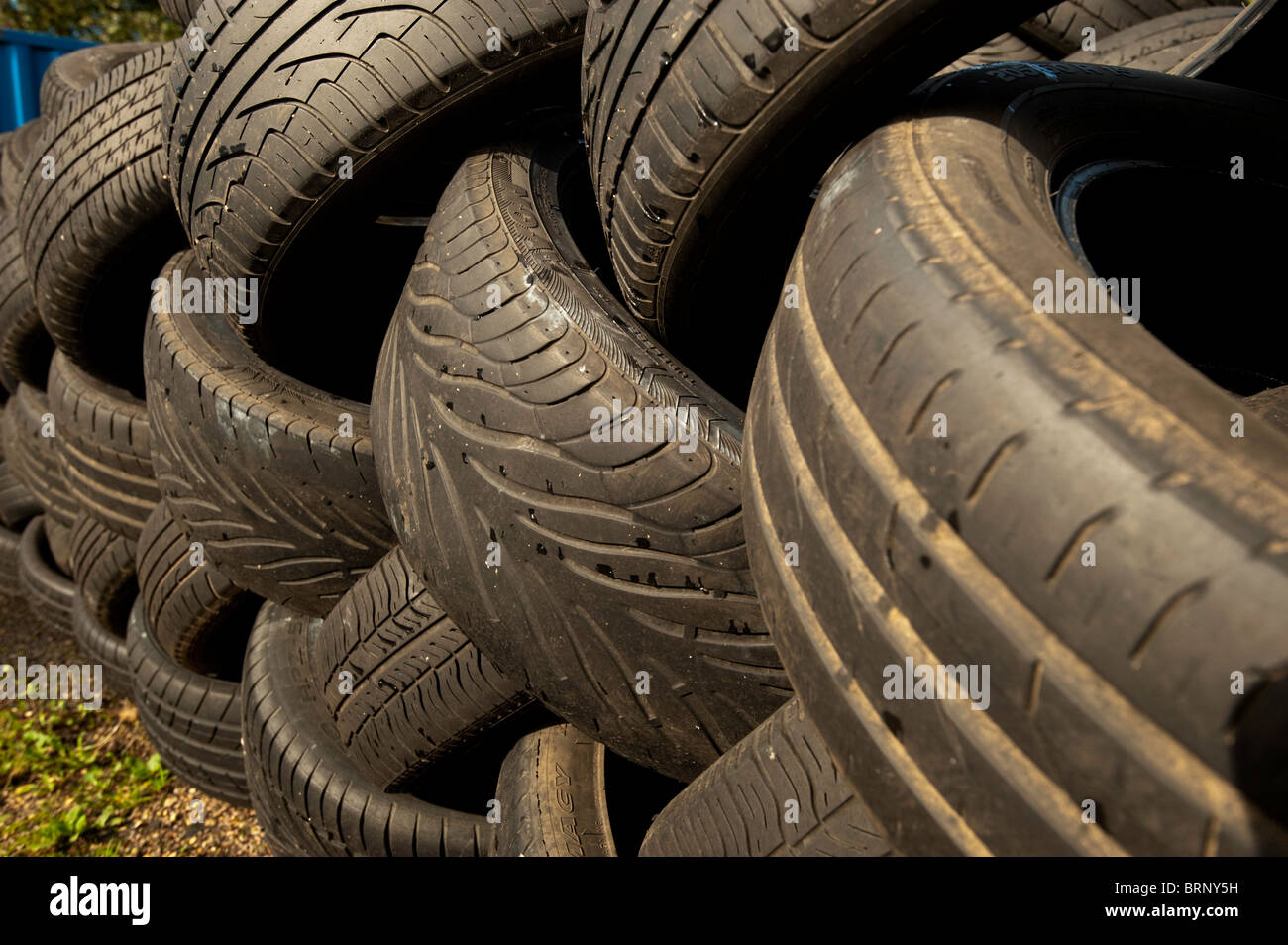 Number of used car tyres laced together to form a casing heap Stock ...