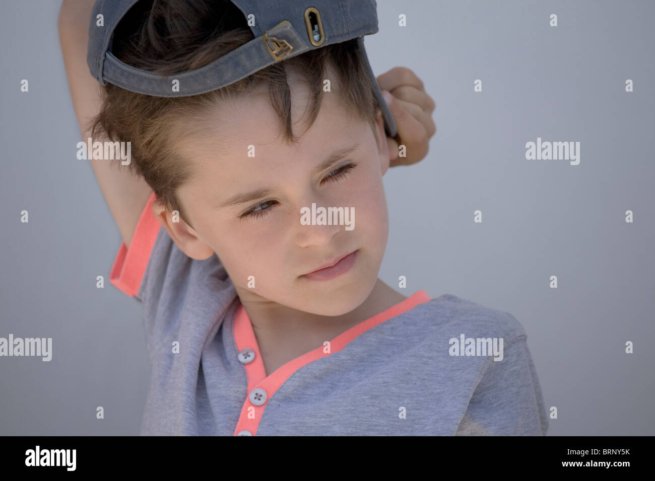 boy thoughtful thinking child kid think cap idea Stock Photo - Alamy