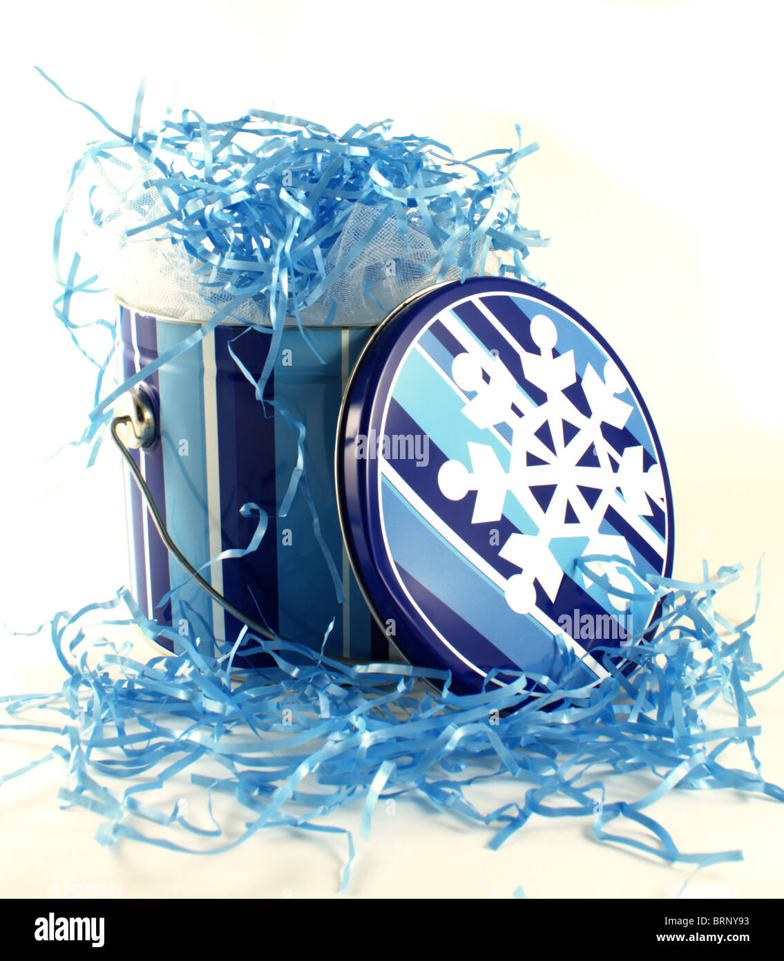 Blue Tin Package with Blue Packaging Paper Stock Photo - Alamy