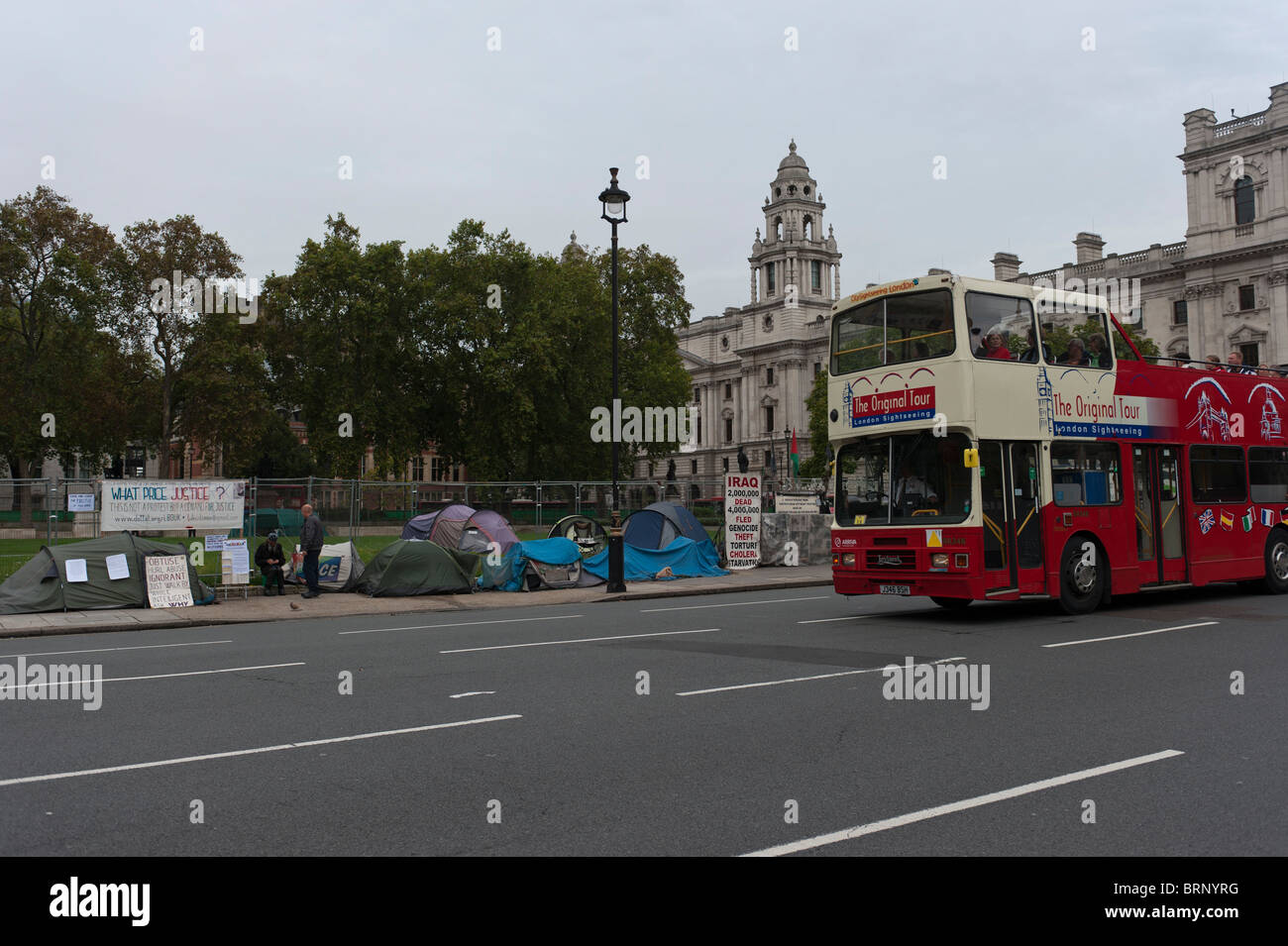 London tourist bus drives past peace protesters from the "peace strike ...