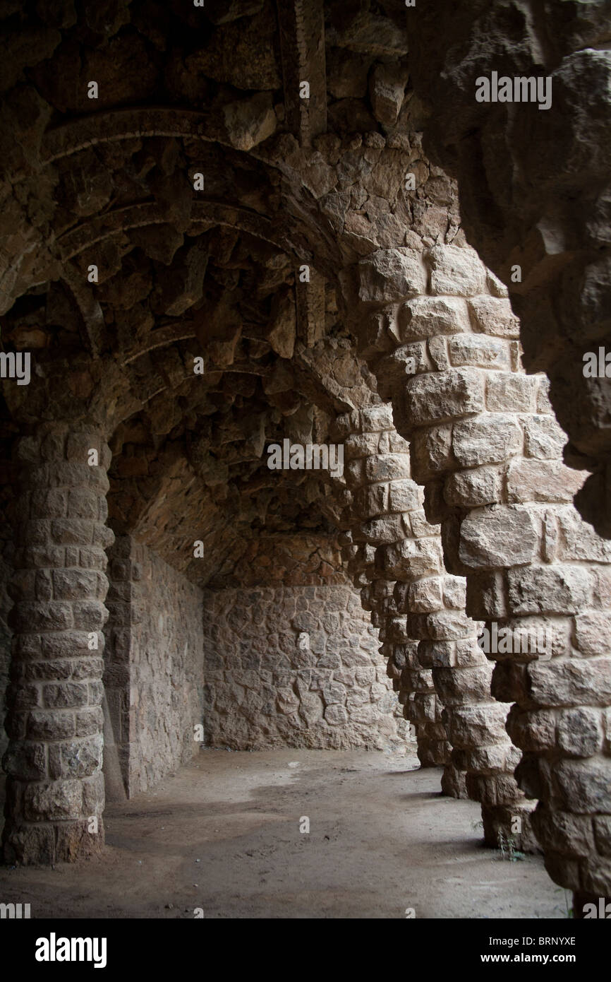 Twisting rock pillars mimicing tree trunks supporing a walkway in the ...