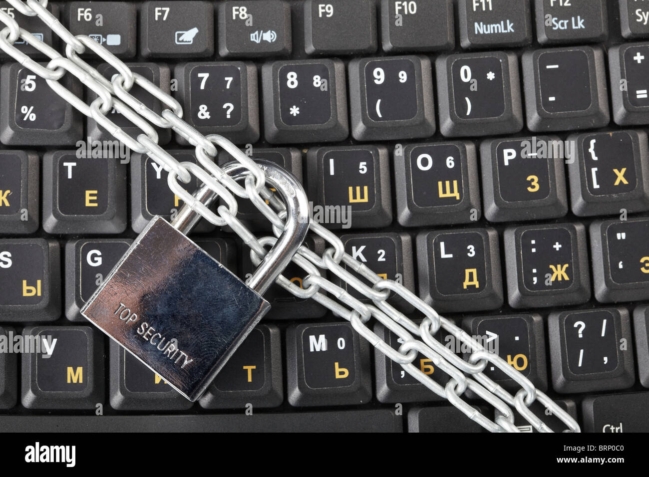 laptop keyboard secured with chain and padlock Stock Photo - Alamy