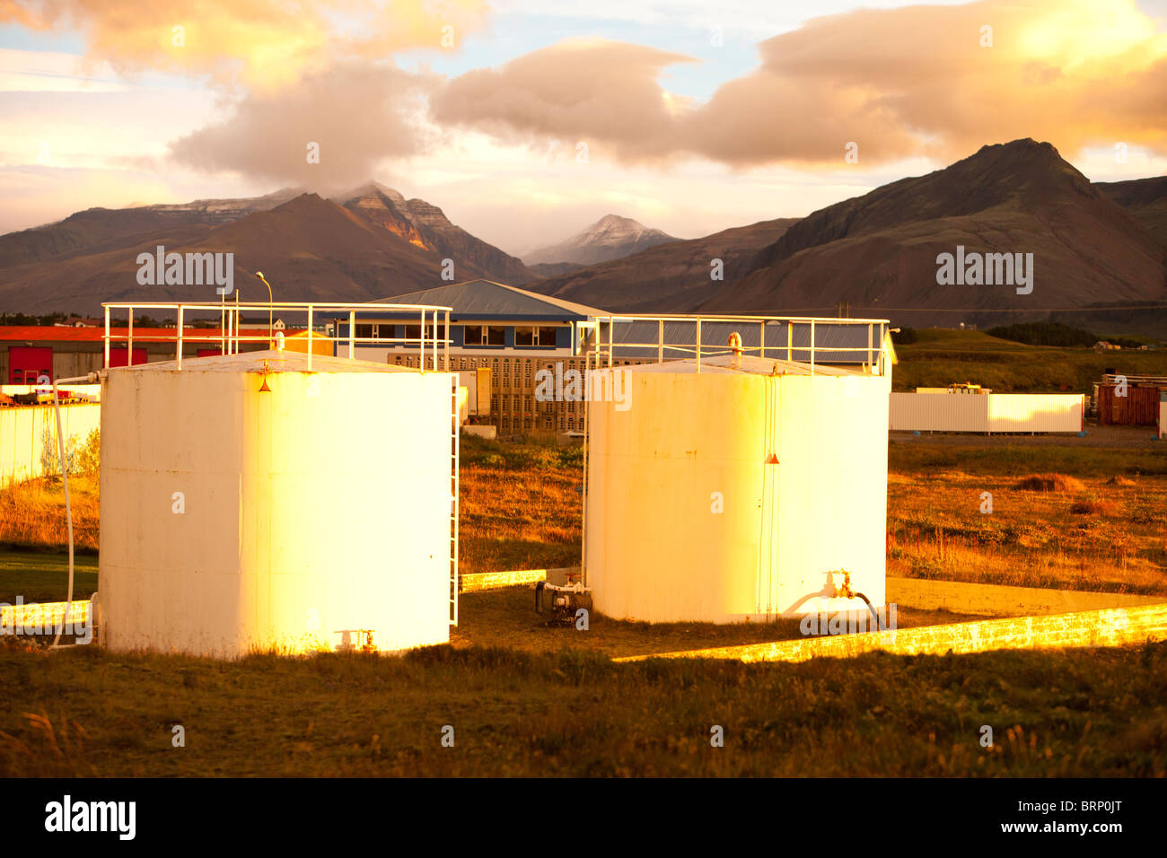 Dawn light at sunrise on an oil storage depot in Hofn on Iceland's ...