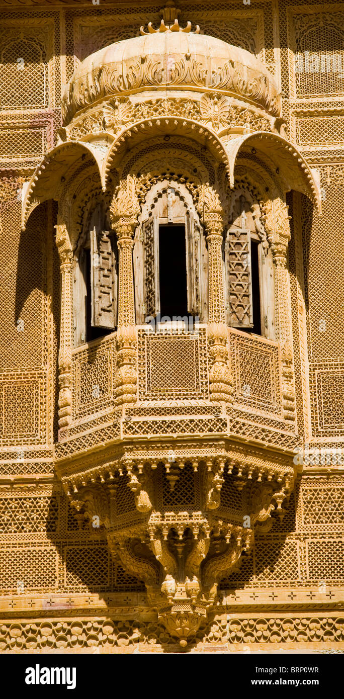A decorative hand carved stone window at the front of the Patwon ki ...