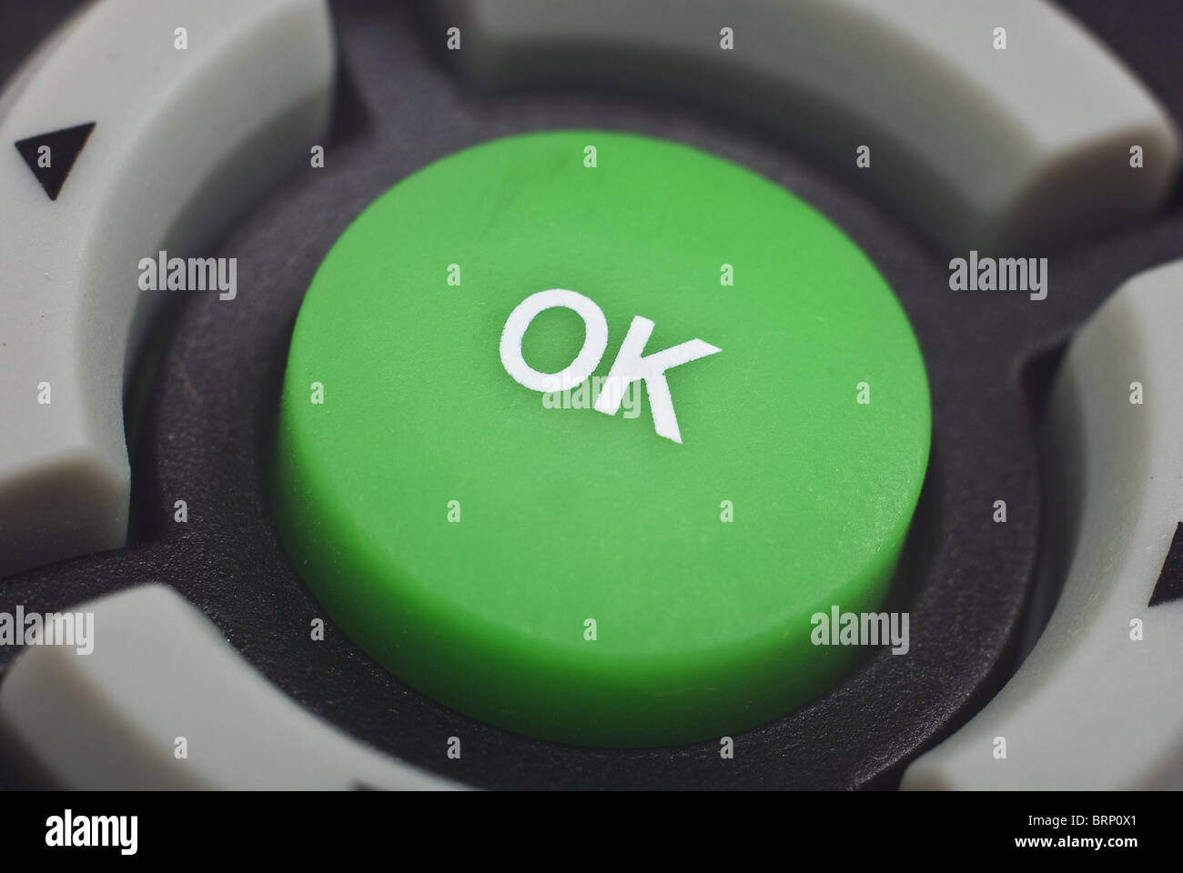 Remote control green button OK Stock Photo - Alamy
