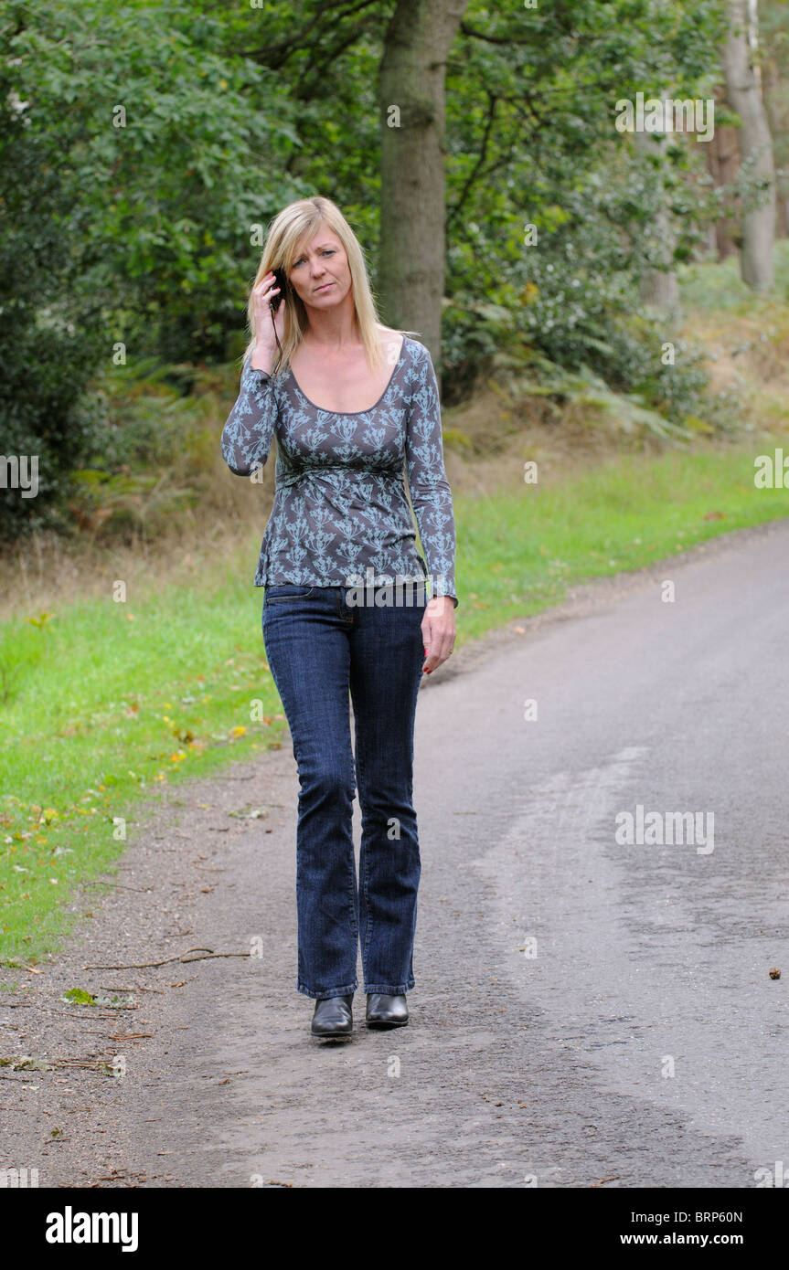 Woman country lane walking hi-res stock photography and images - Alamy
