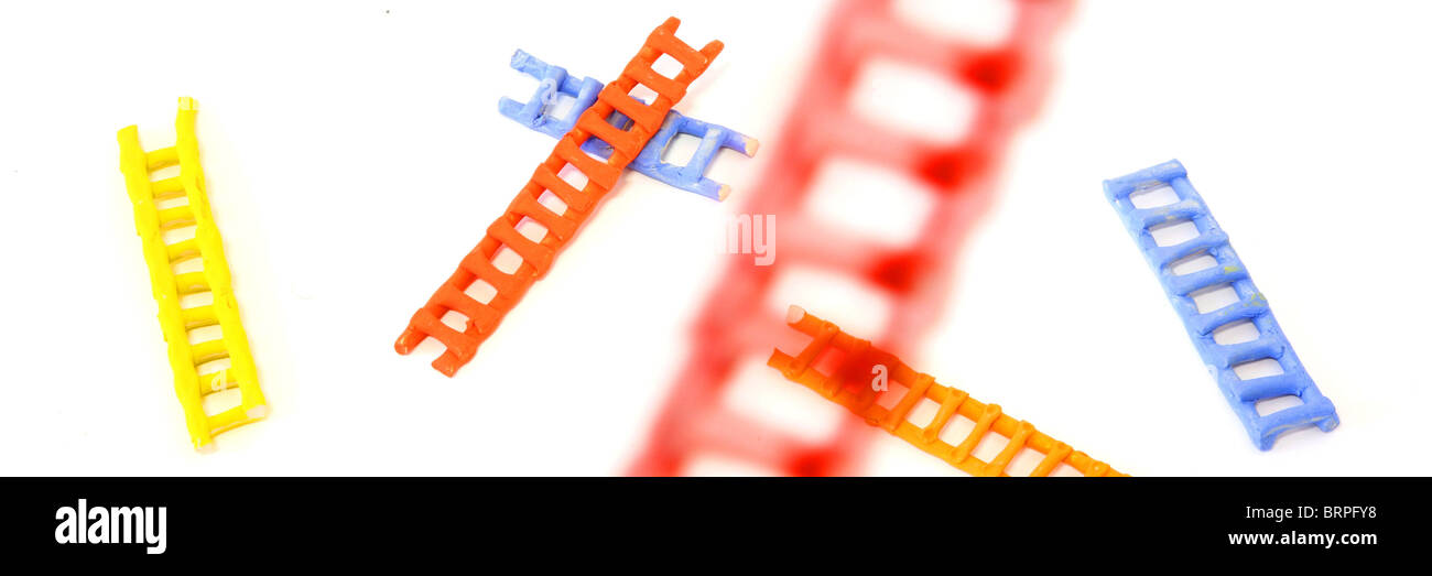 Multi coloured ceramic ladders on white background Stock Photo - Alamy