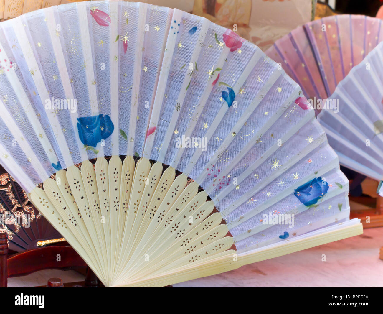 Hand held fan displays hi-res stock photography and images - Alamy