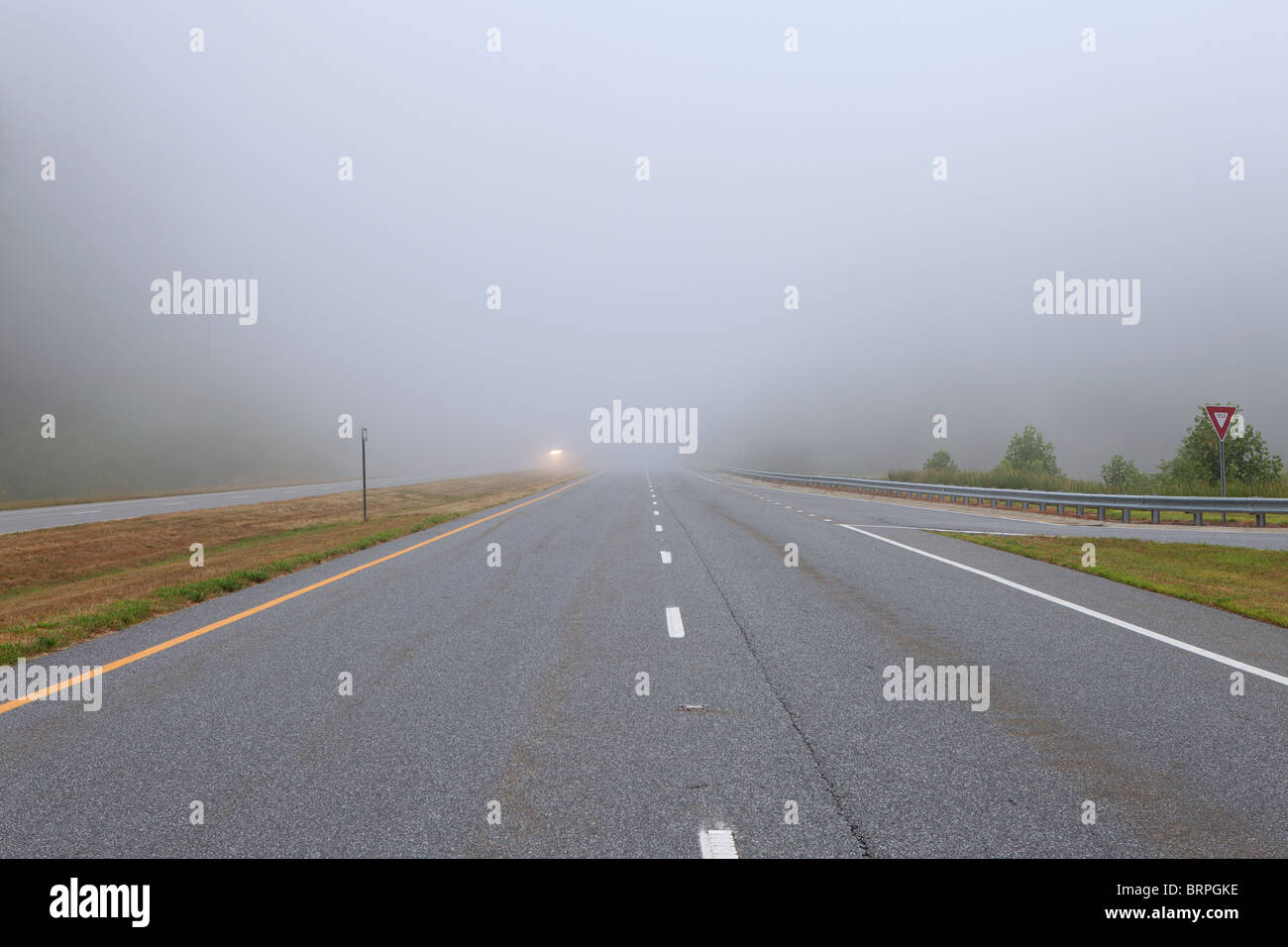 Road and fog Stock Photo - Alamy