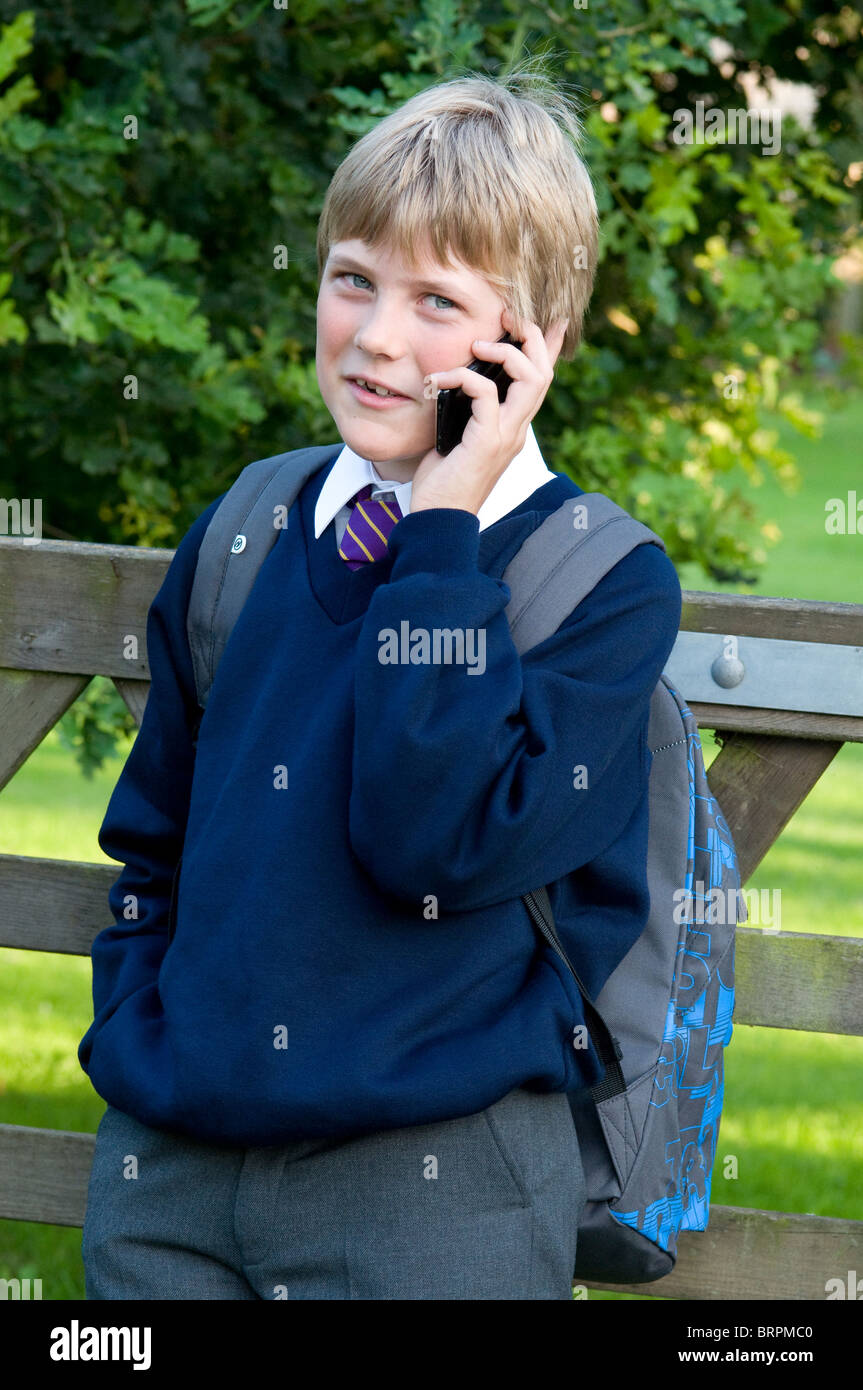 Schoolboy using mobile phone Stock Photo - Alamy