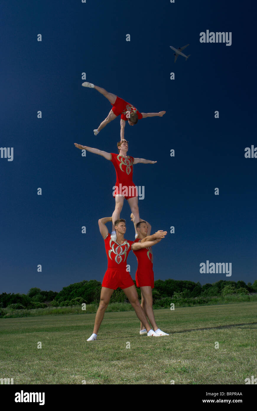 Acrobatic troop performing moves Stock Photo - Alamy