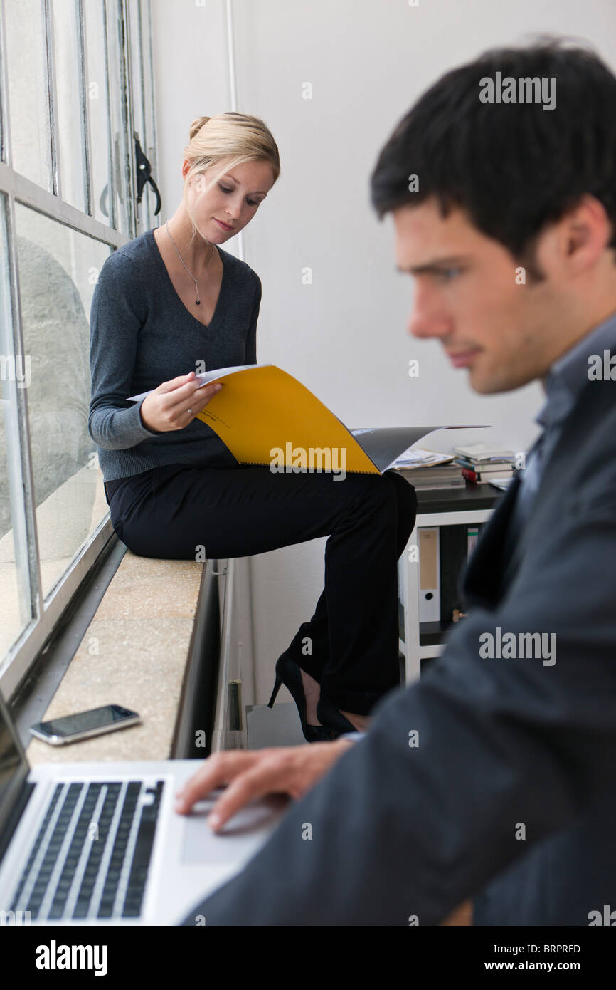 Reviewing a business plan together Stock Photo - Alamy