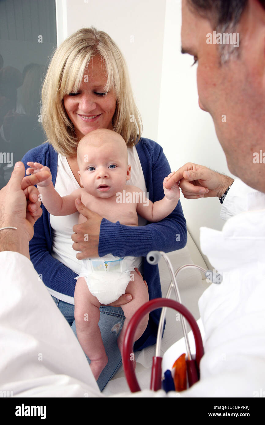 Doctor's surgery, paediatrician. Mother and baby. Medical examination ...