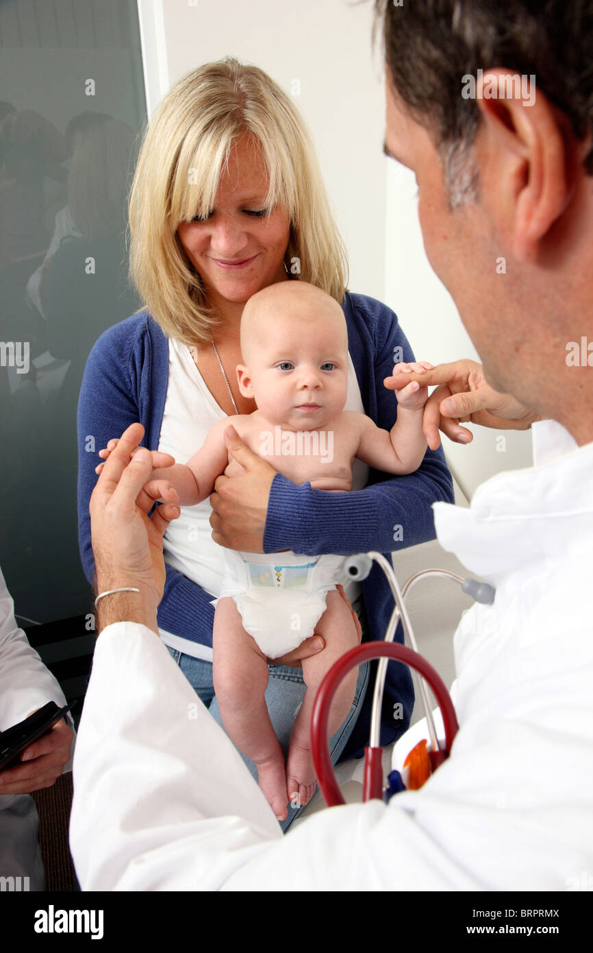 Doctor's surgery, paediatrician. Mother and baby. Medical examination ...