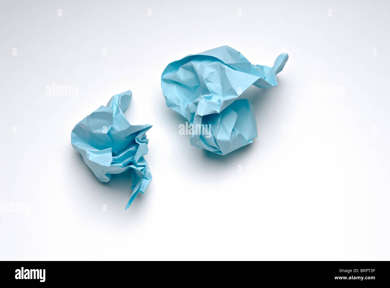 Two crumpled light blue paper balls Stock Photo - Alamy