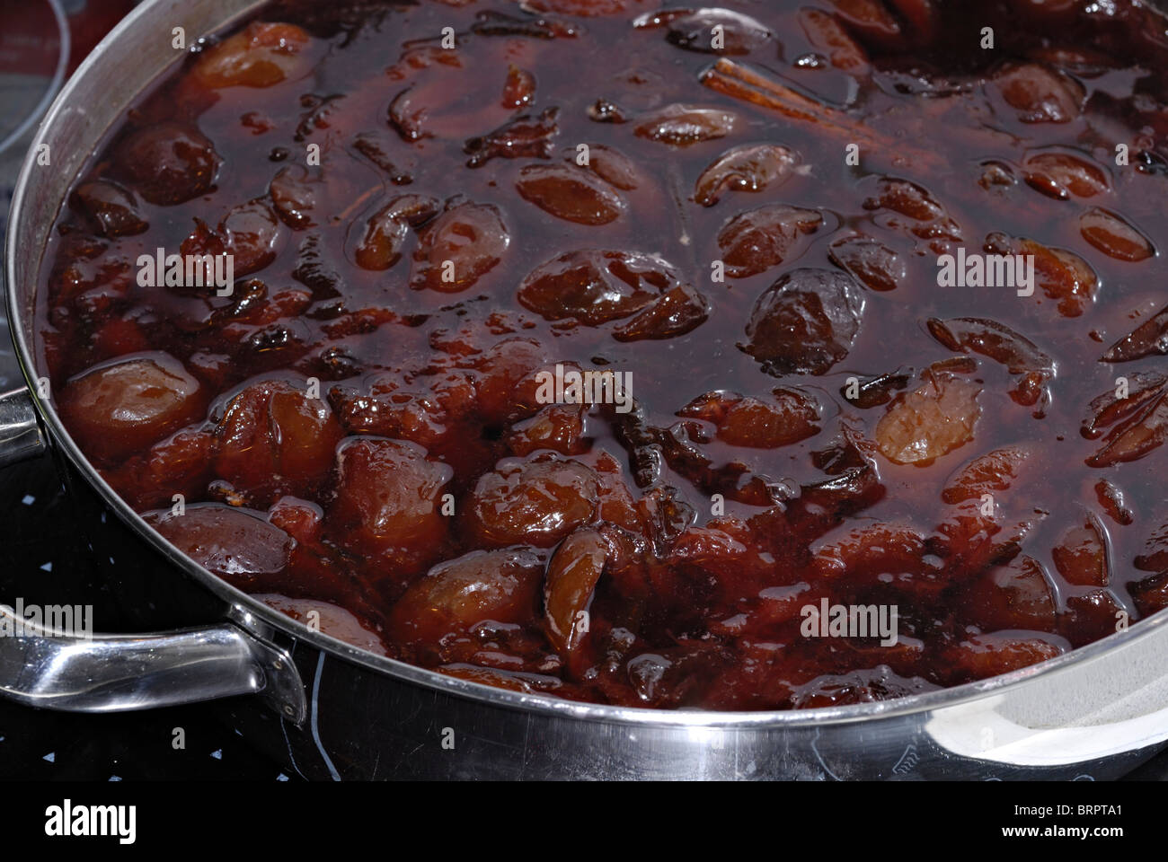 Plum jam cooking in stainless steel pot Stock Photo - Alamy