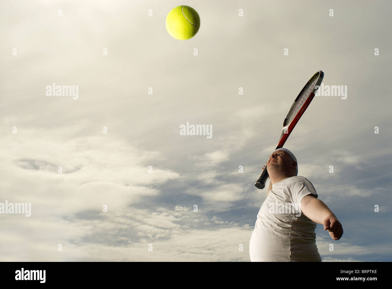 Large tennis player with giant racquet Stock Photo - Alamy