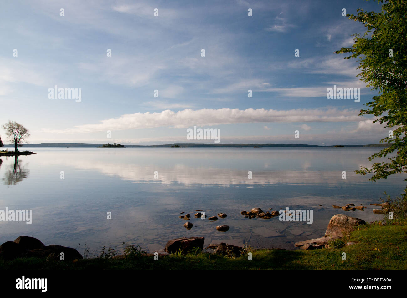 The sky reflected in Lake Manitou Stock Photo - Alamy
