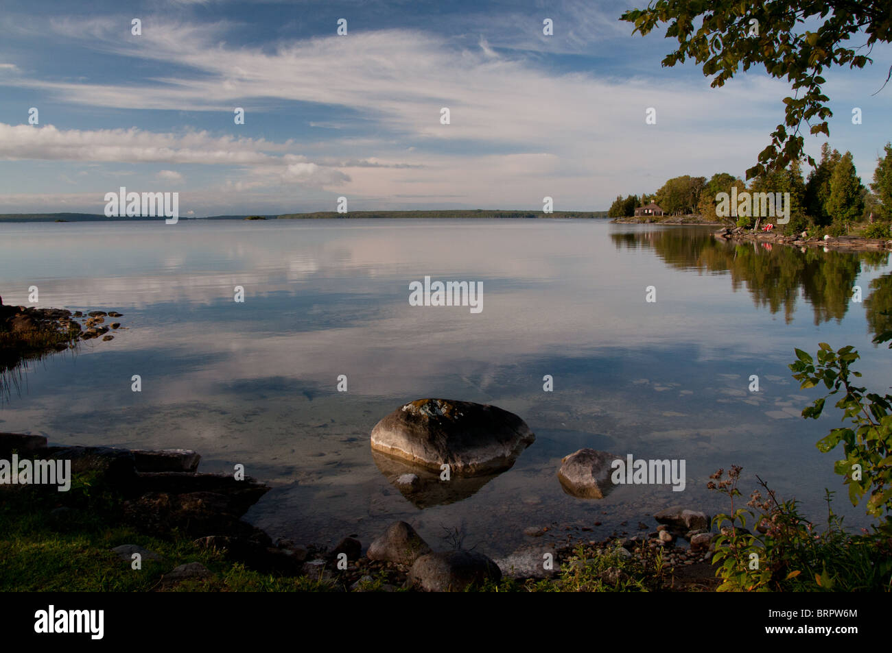 The sky reflected in Lake Manitou Stock Photo - Alamy
