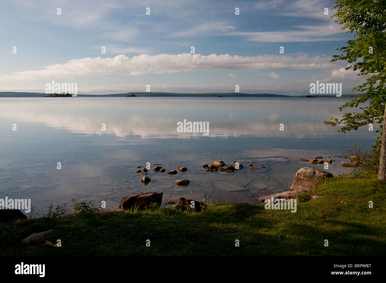 The sky reflected in Lake Manitou Stock Photo - Alamy