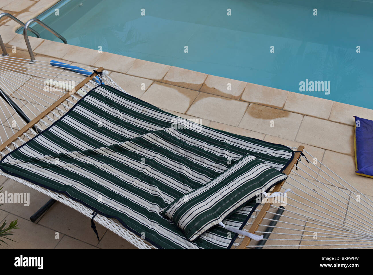 Hammock at swimming poolside Stock Photo - Alamy