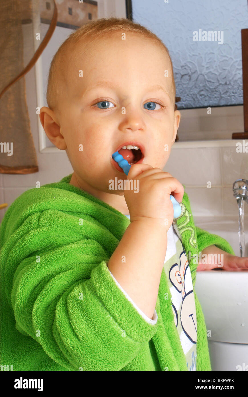Dental care - small boy washing his teeth in the morning time Stock ...