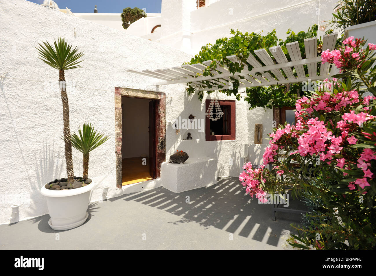 Brightly colored house on the Greek island of Santorini Stock Photo - Alamy